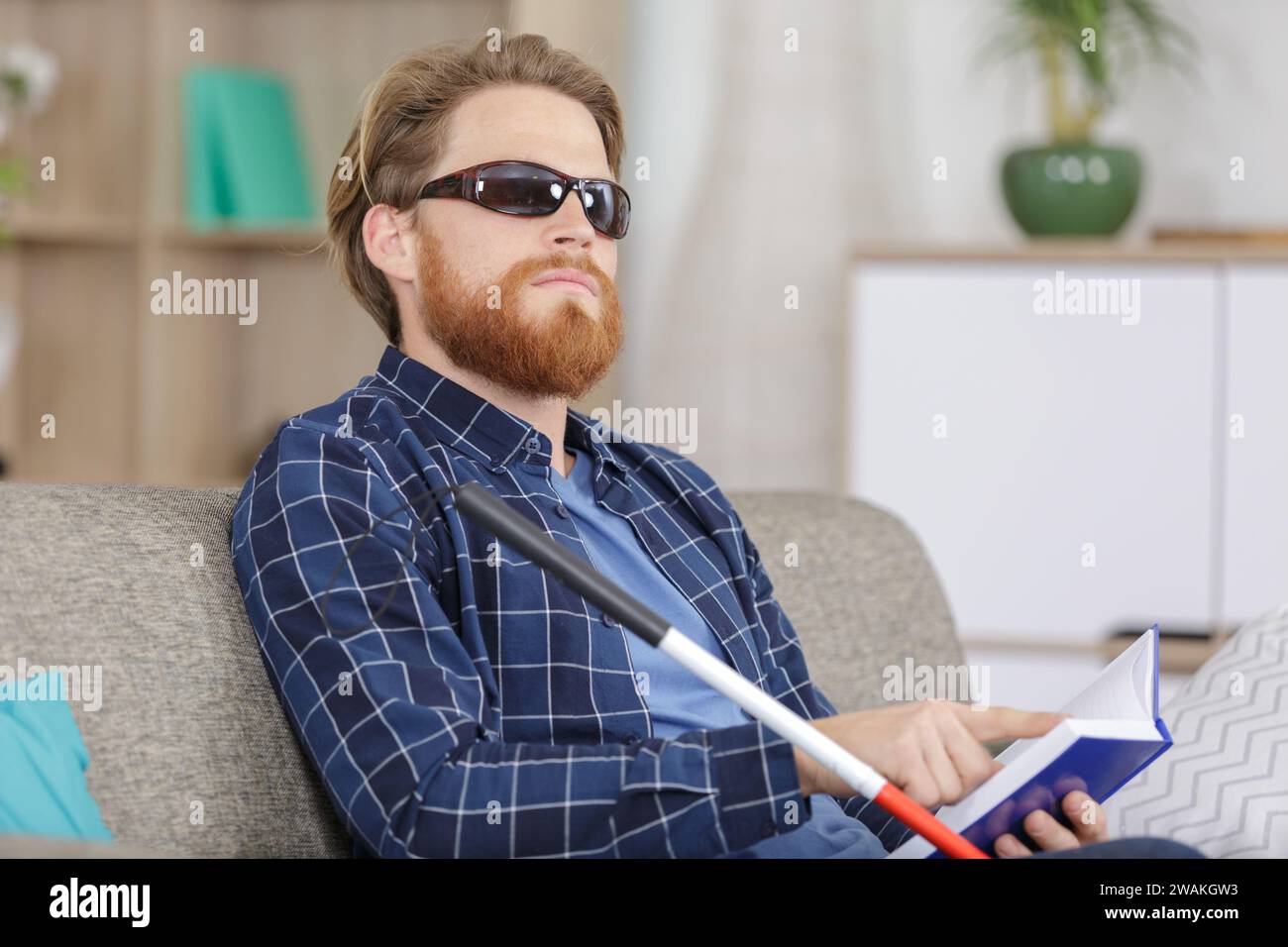 blind man reading braille at home Stock Photo - Alamy