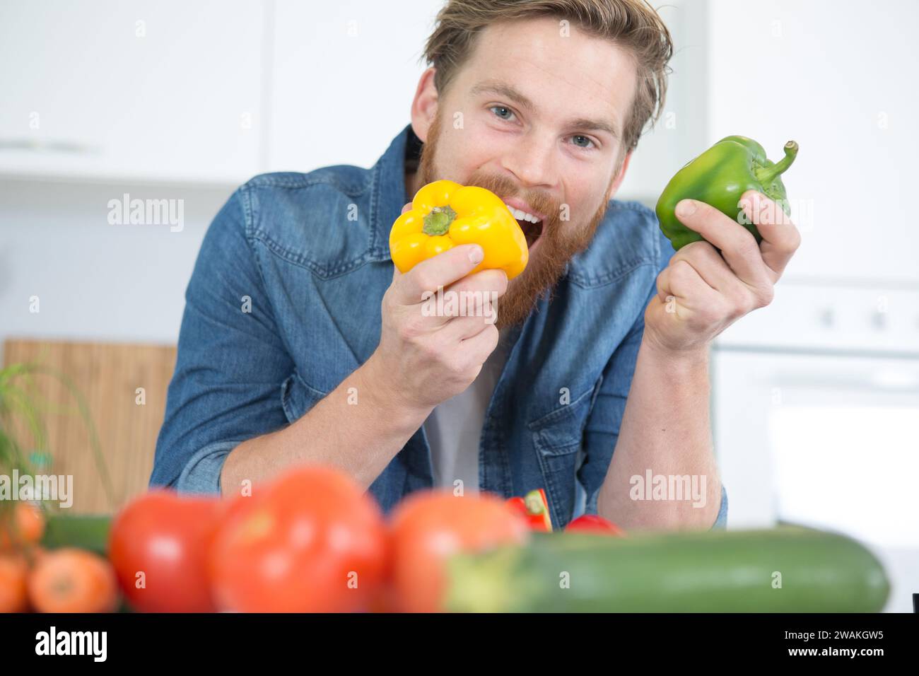 funny man playing with pepers Stock Photo - Alamy