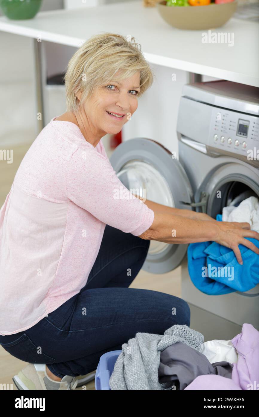 Lady doing laundry hi-res stock photography and images - Alamy