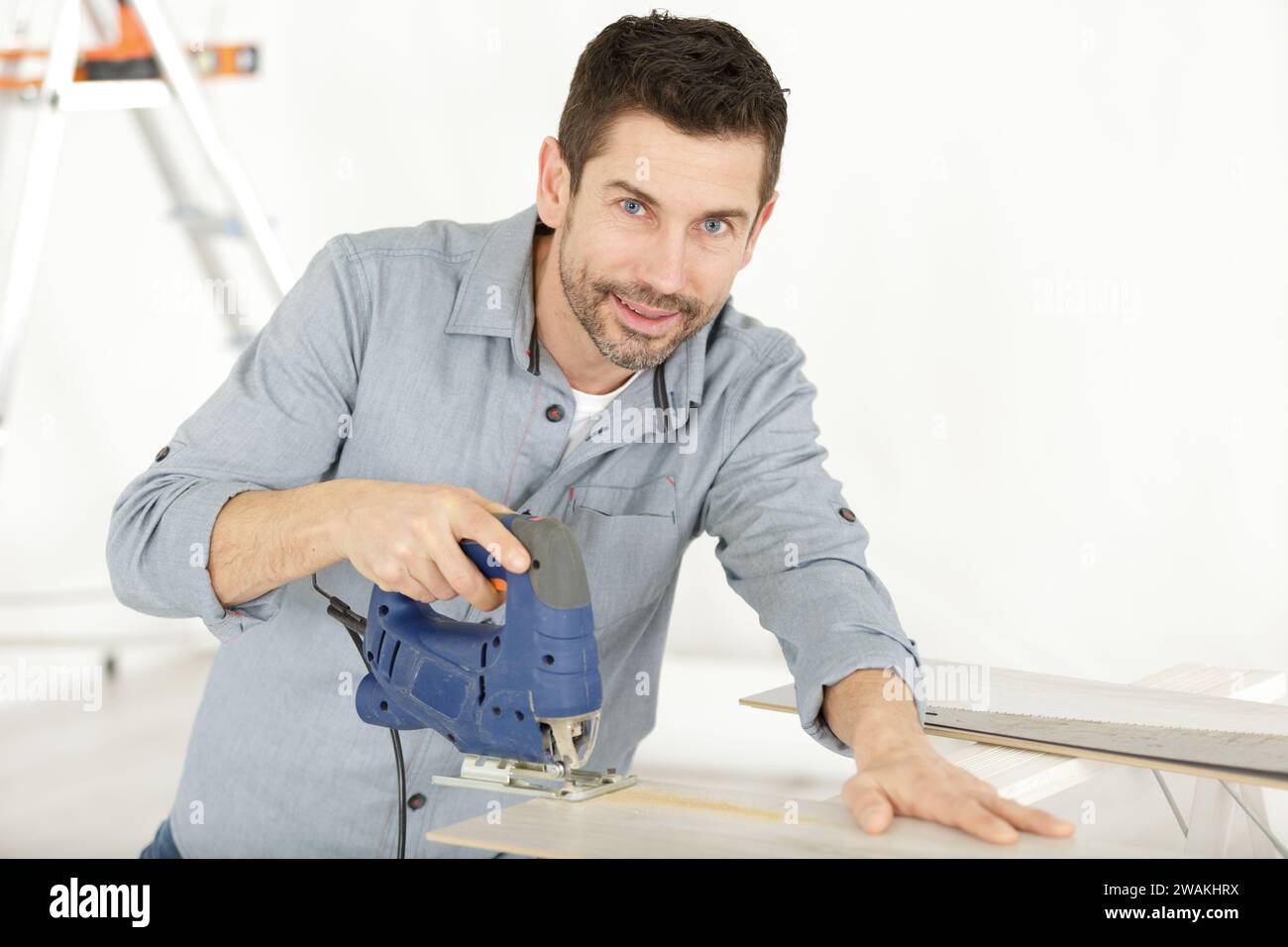 Man cuts board manual electric hi-res stock photography and images - Alamy