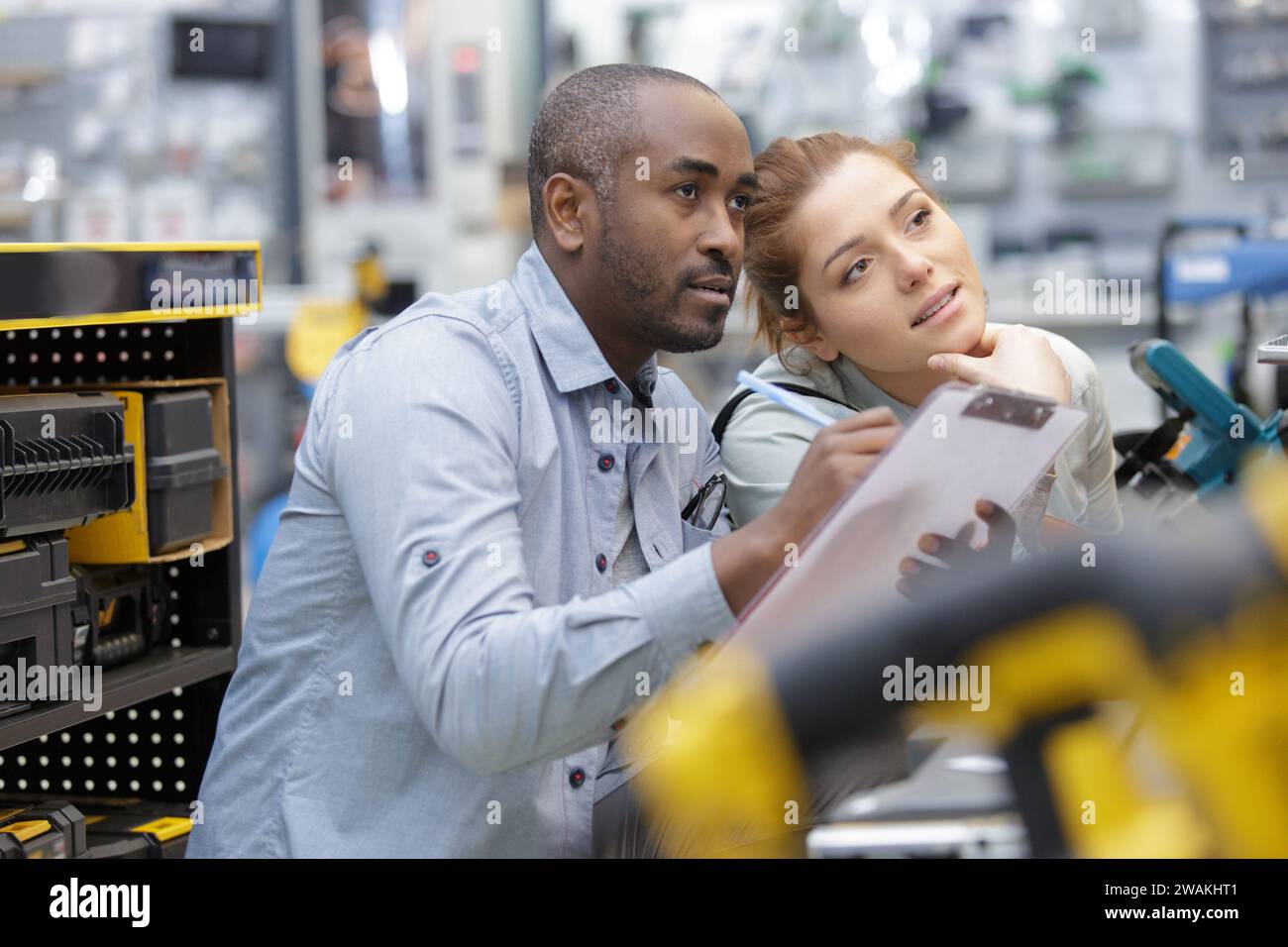 customer and warehouse store assistant Stock Photo - Alamy
