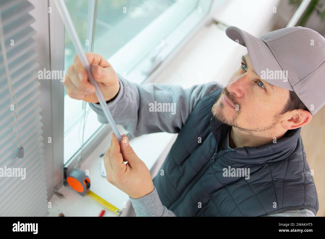 Installing window blinds hi-res stock photography and images - Alamy