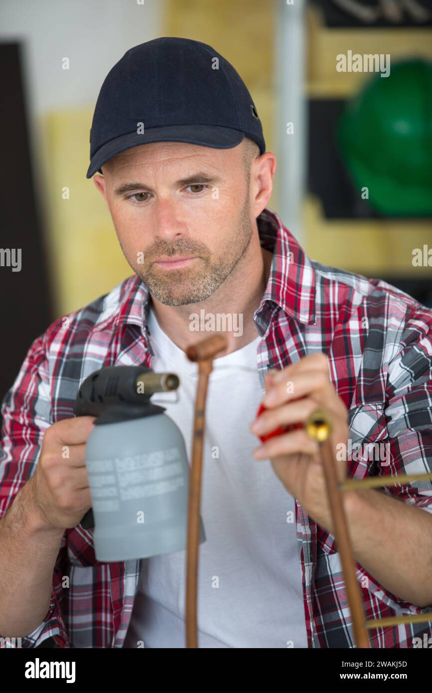 Plumber using blow torch hi-res stock photography and images - Alamy