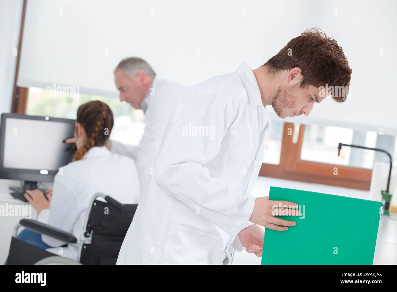 scientist filling a flask in a chemical laboratory Stock Photo - Alamy