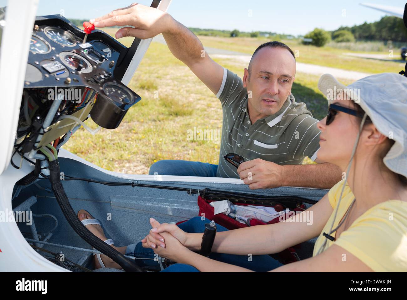 man and woman talking about glider instructions Stock Photo - Alamy