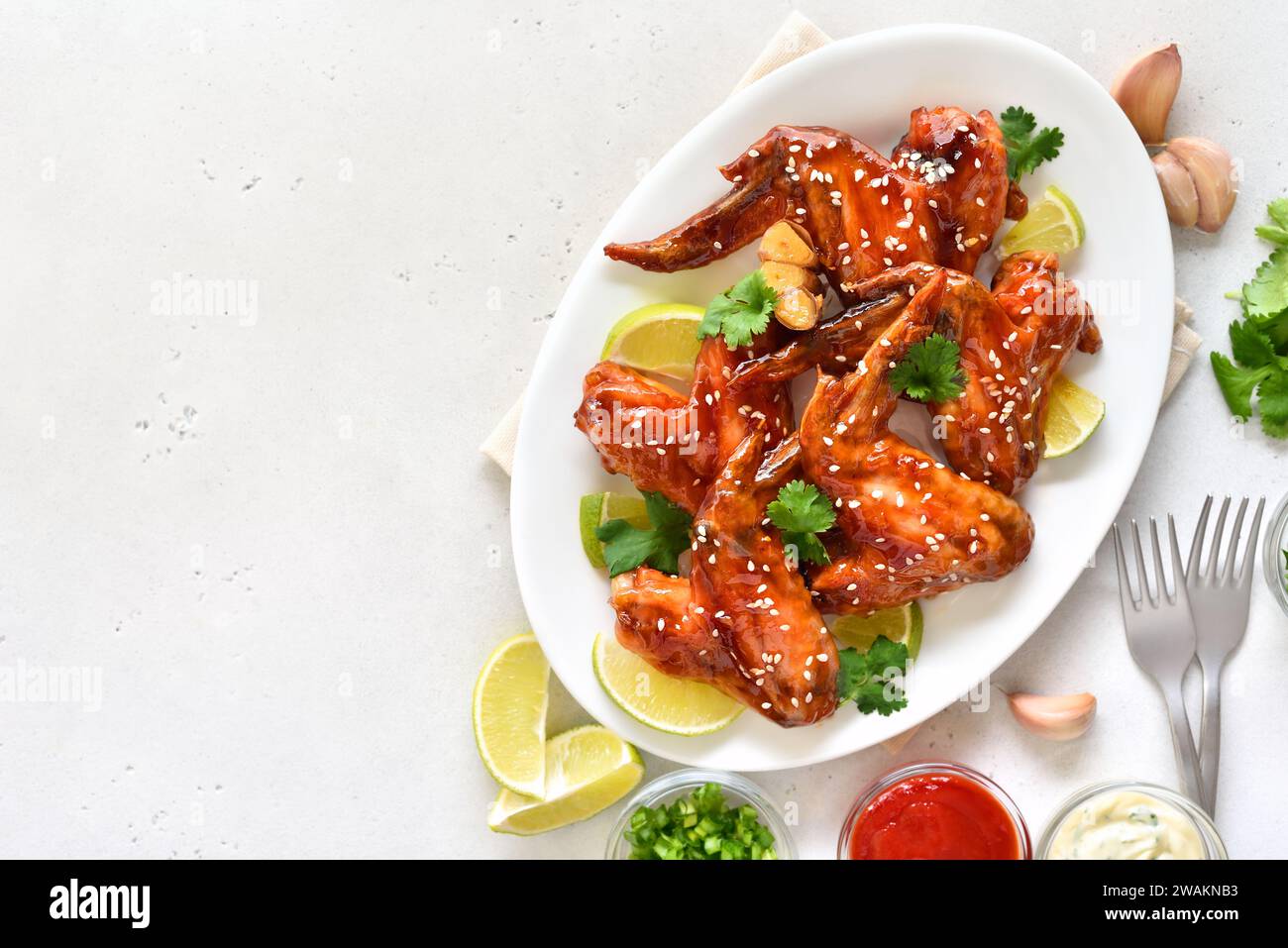 Buffalo chicken wings on plate over white stone background with copy ...