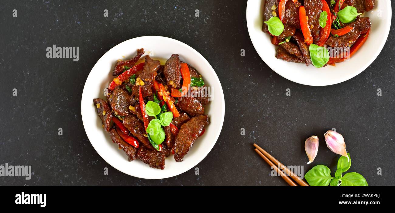 Thai style stir-fry beef with vegetables in bowl. Top view, flat lay ...