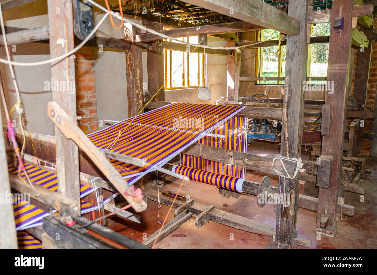 Cotton weaving on a traditional wooden handloom Stock Photo - Alamy