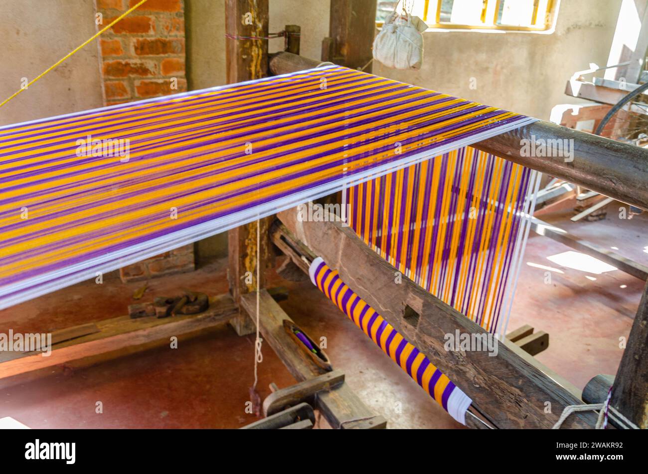 Cotton weaving on a traditional wooden handloom Stock Photo - Alamy
