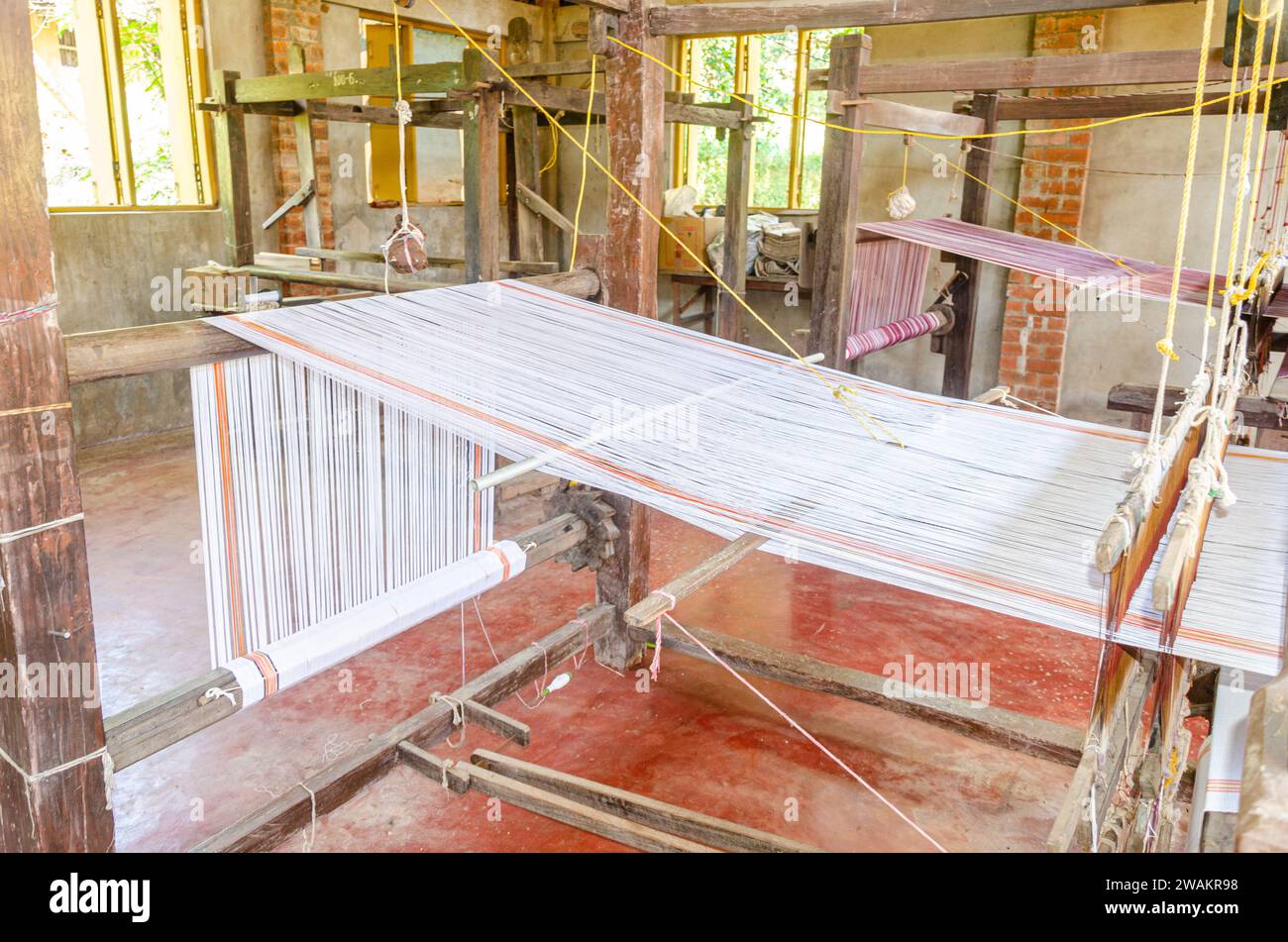 Cotton weaving on a traditional wooden handloom Stock Photo - Alamy