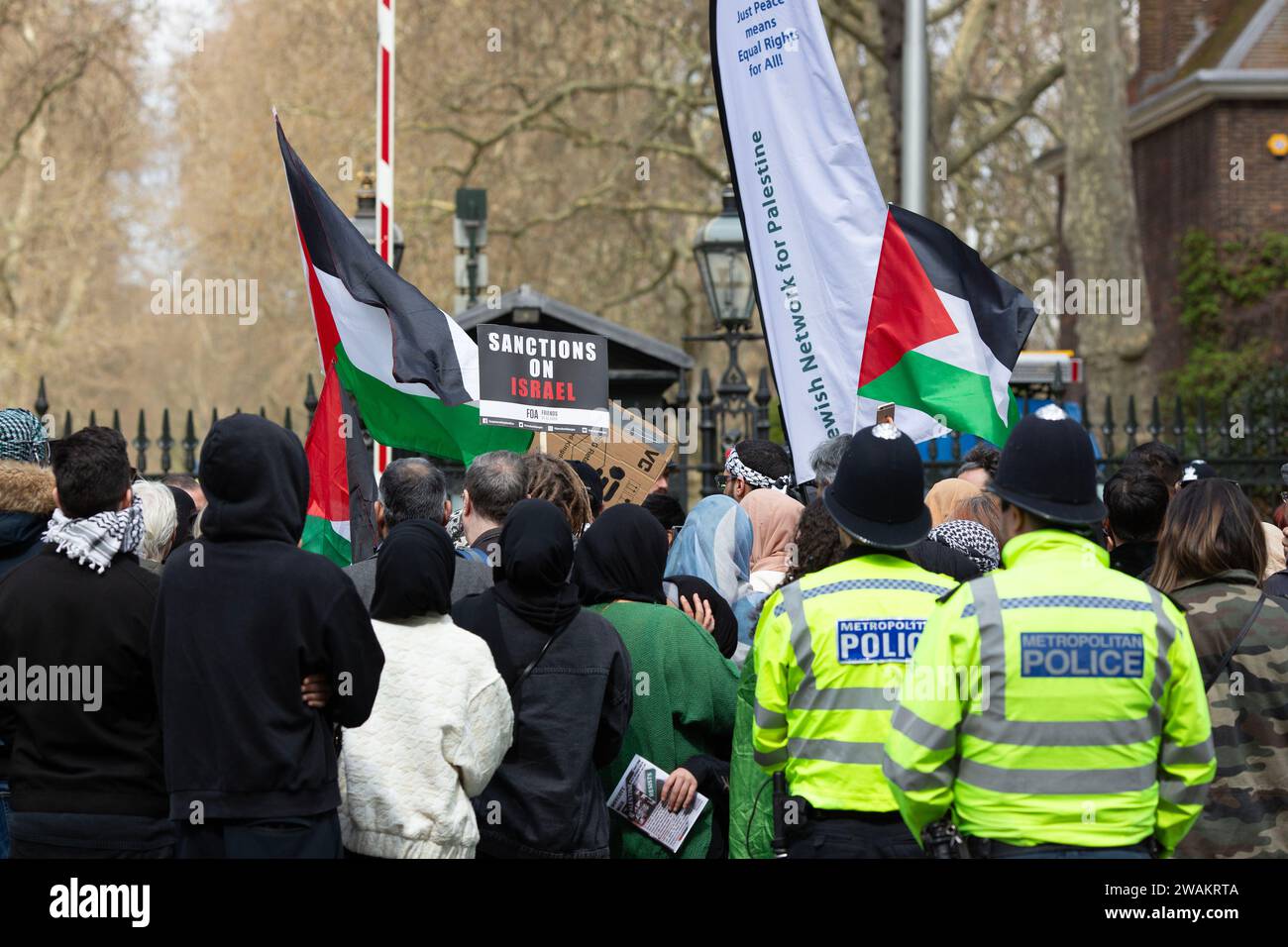 Pro-Palestinian protesters gather with flags and placards during a ...