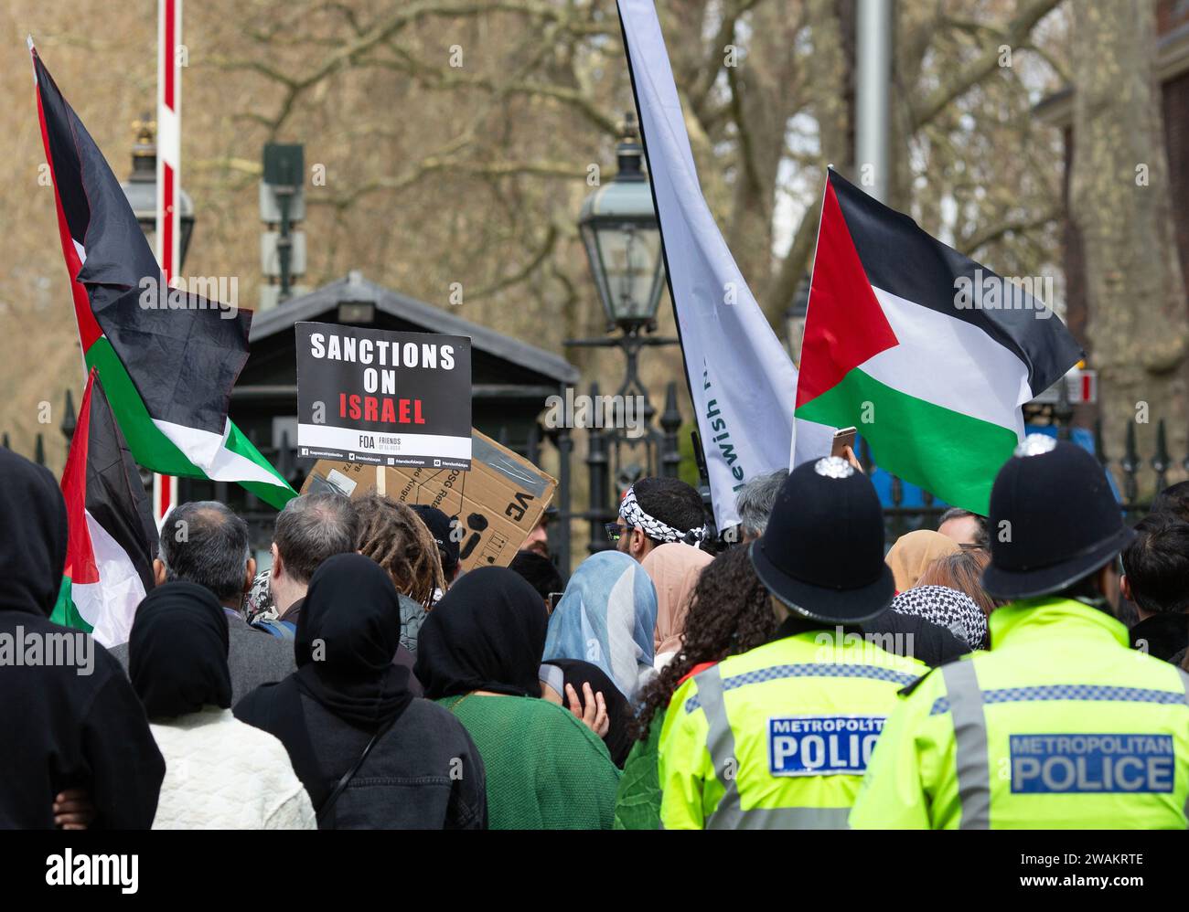Pro-Palestinian protesters gather with flags and placards during a ...