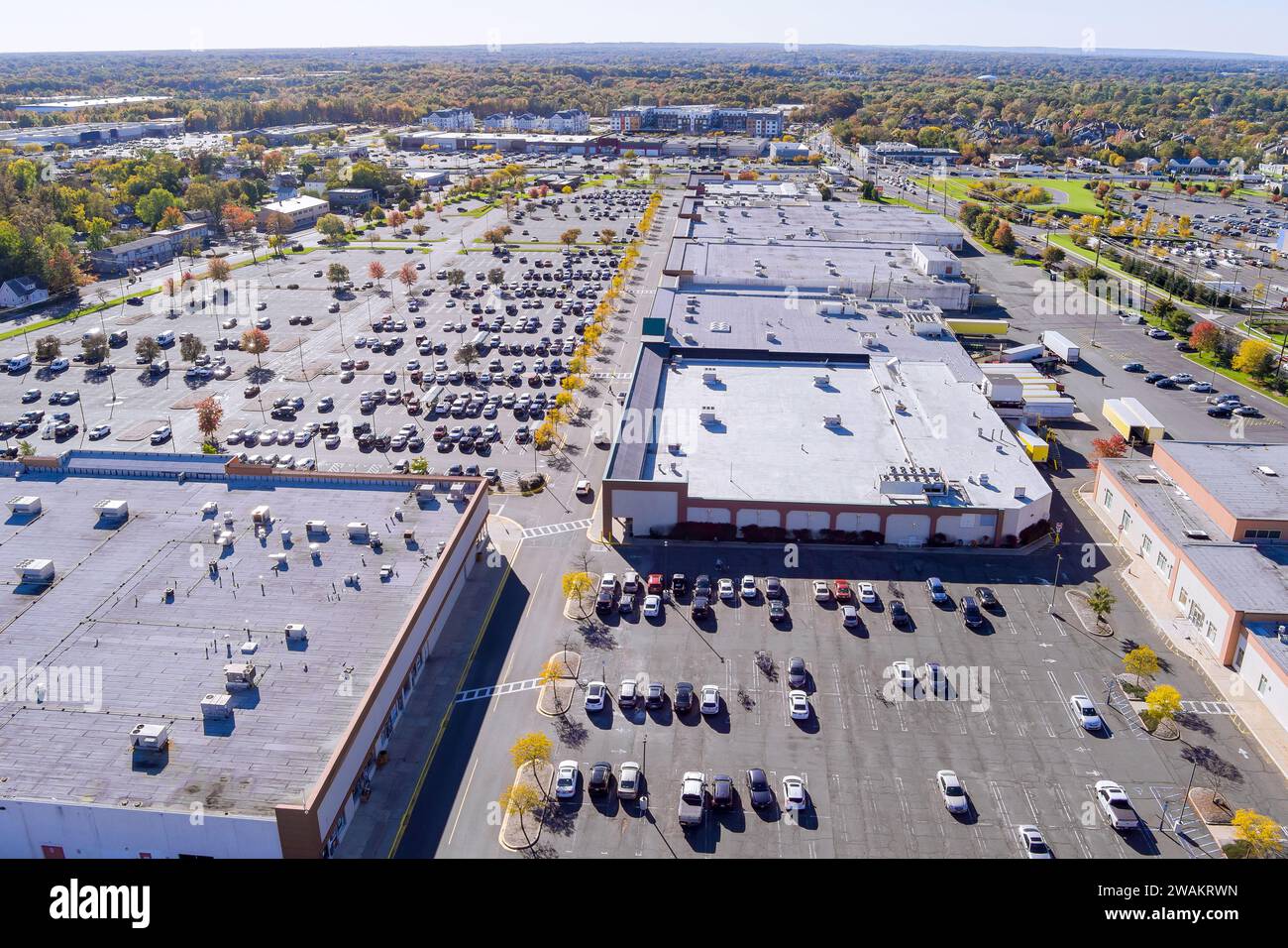 There is large parking lot with cars near shopping mall center in New ...