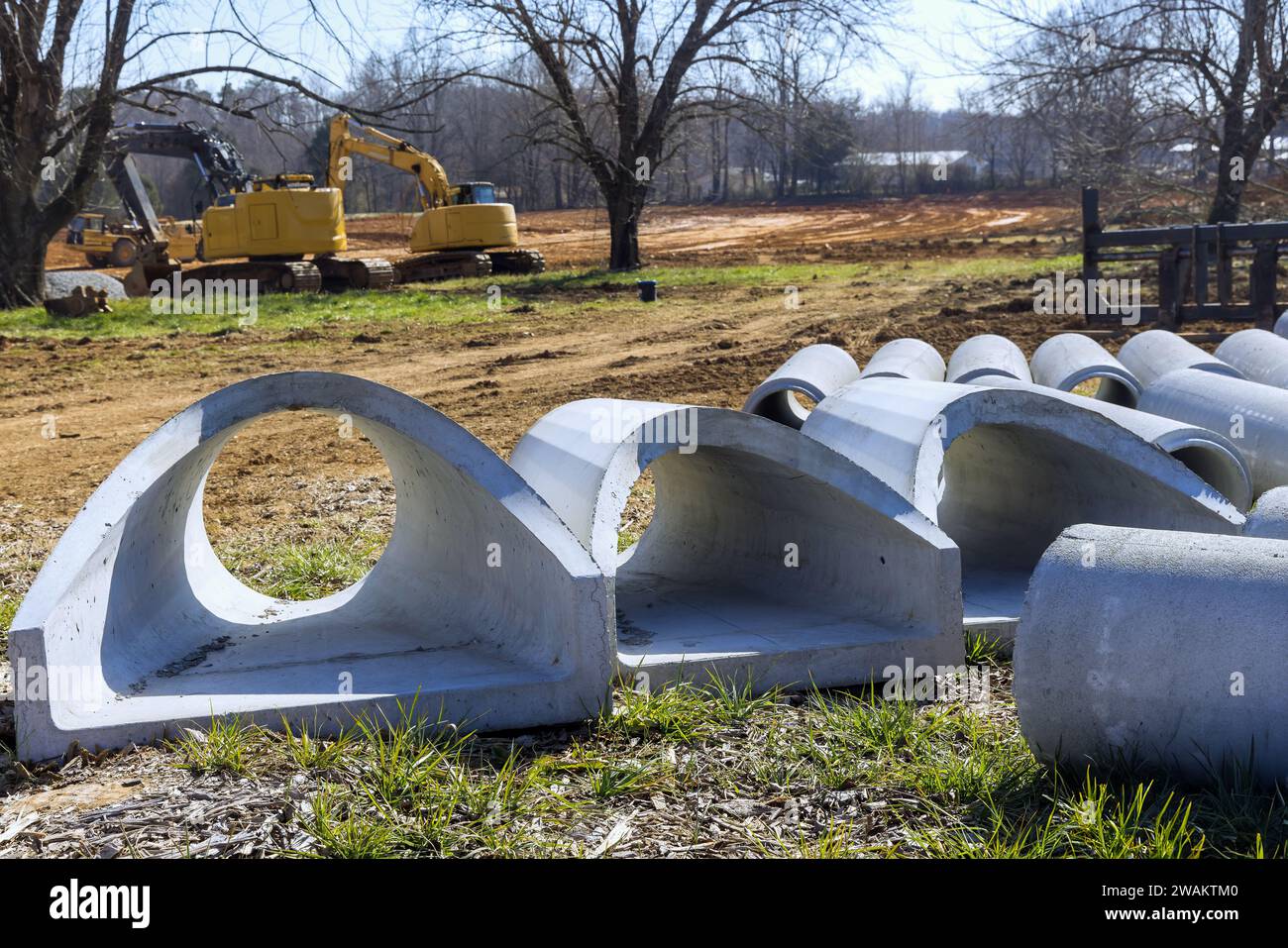 Concrete drainage, sewage, storm water pipes are stacked ready to ...