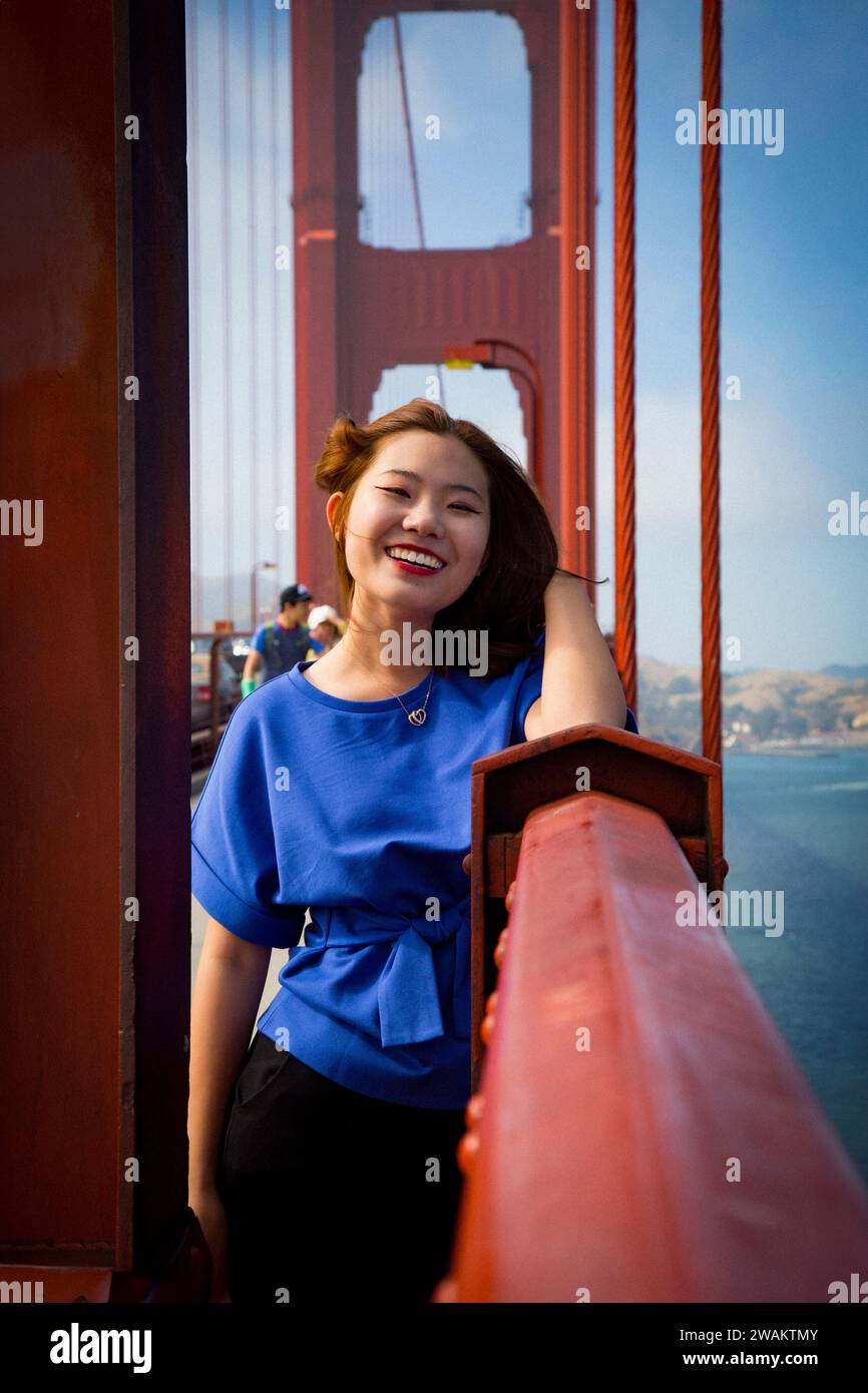 Chinese Teen Tourist Female Wind Blown Hair Leaning on Railing at ...