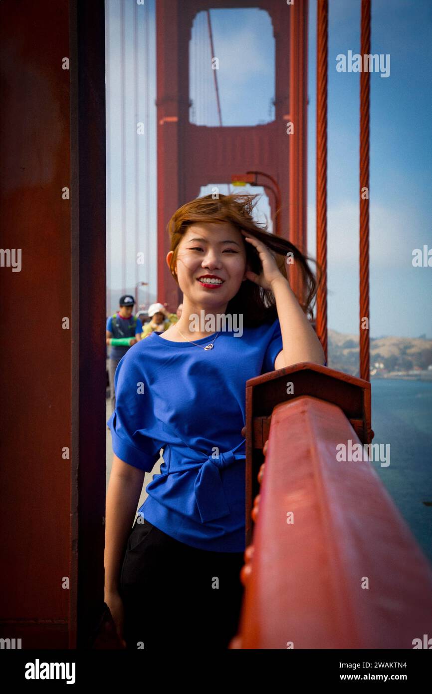 Chinese Teen Tourist Female Wind Blown Hair Leaning on Railing at ...