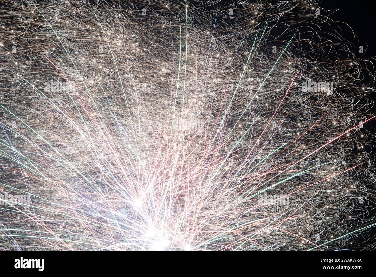 picture with fireworks to welcome the new year, light flowers in the ...