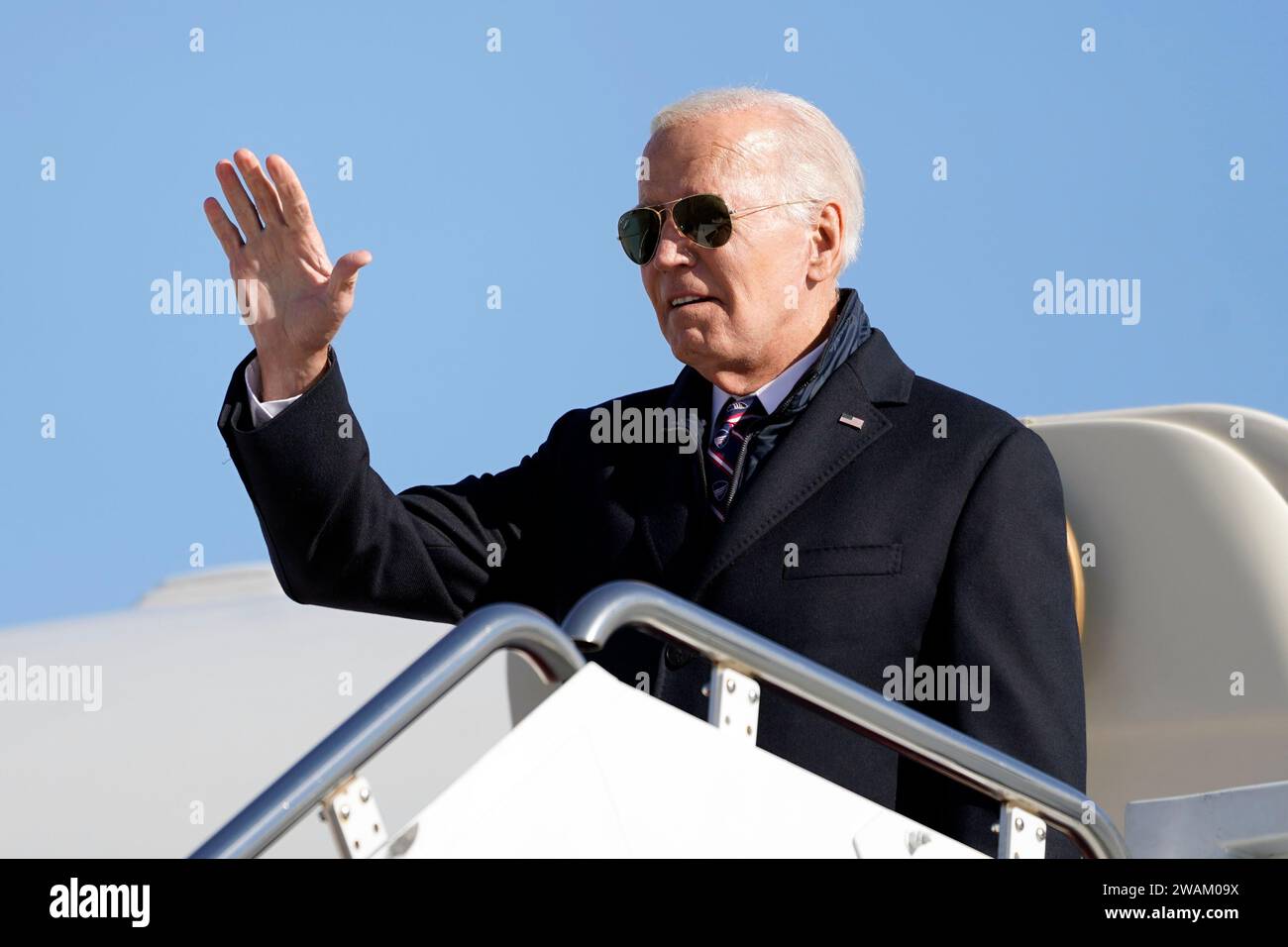 President Joe Biden waves as he boards Air Force One at Andrews Air ...