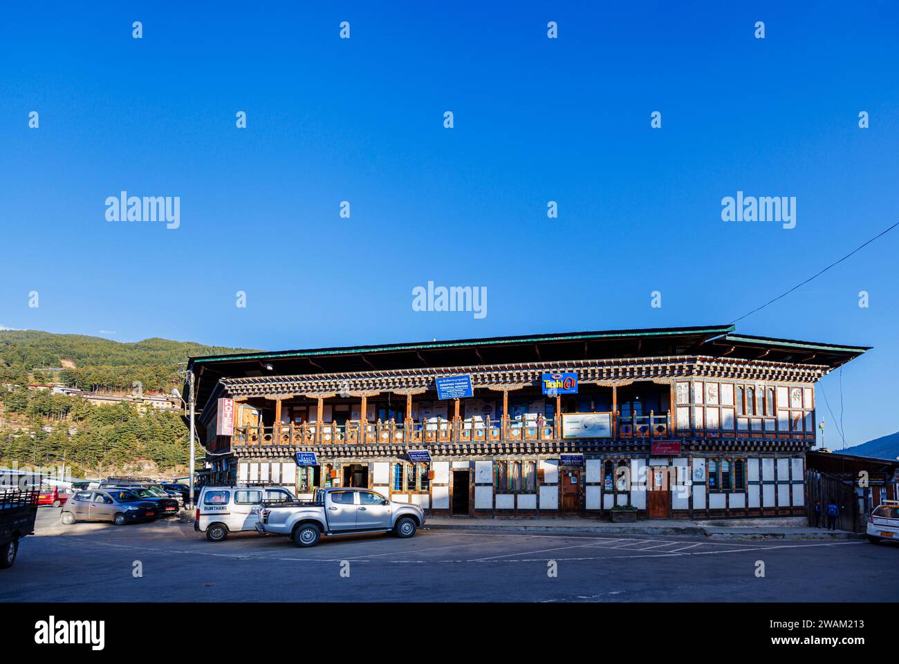 Local shops and administrative offices in the main street of Chamkhar ...