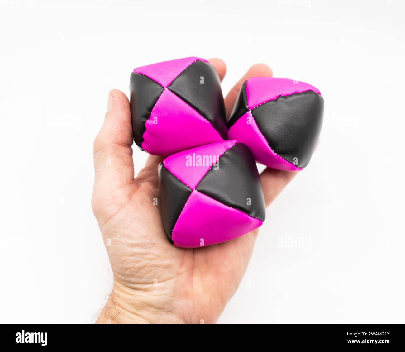 juggling balls bags in hand with white background Stock Photo - Alamy
