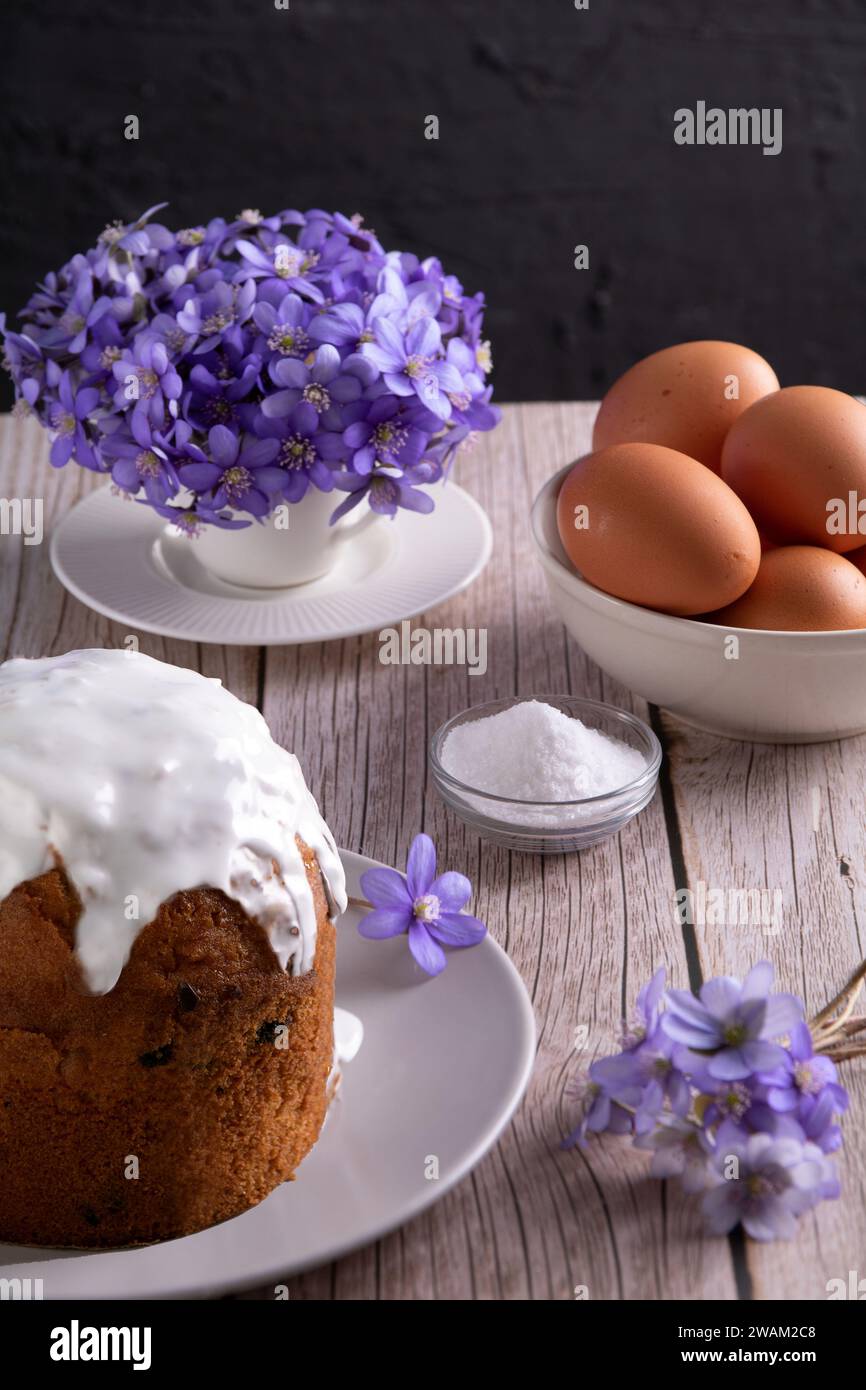 In this vertical photo, a homemade Easter cake, also known as kulich ...