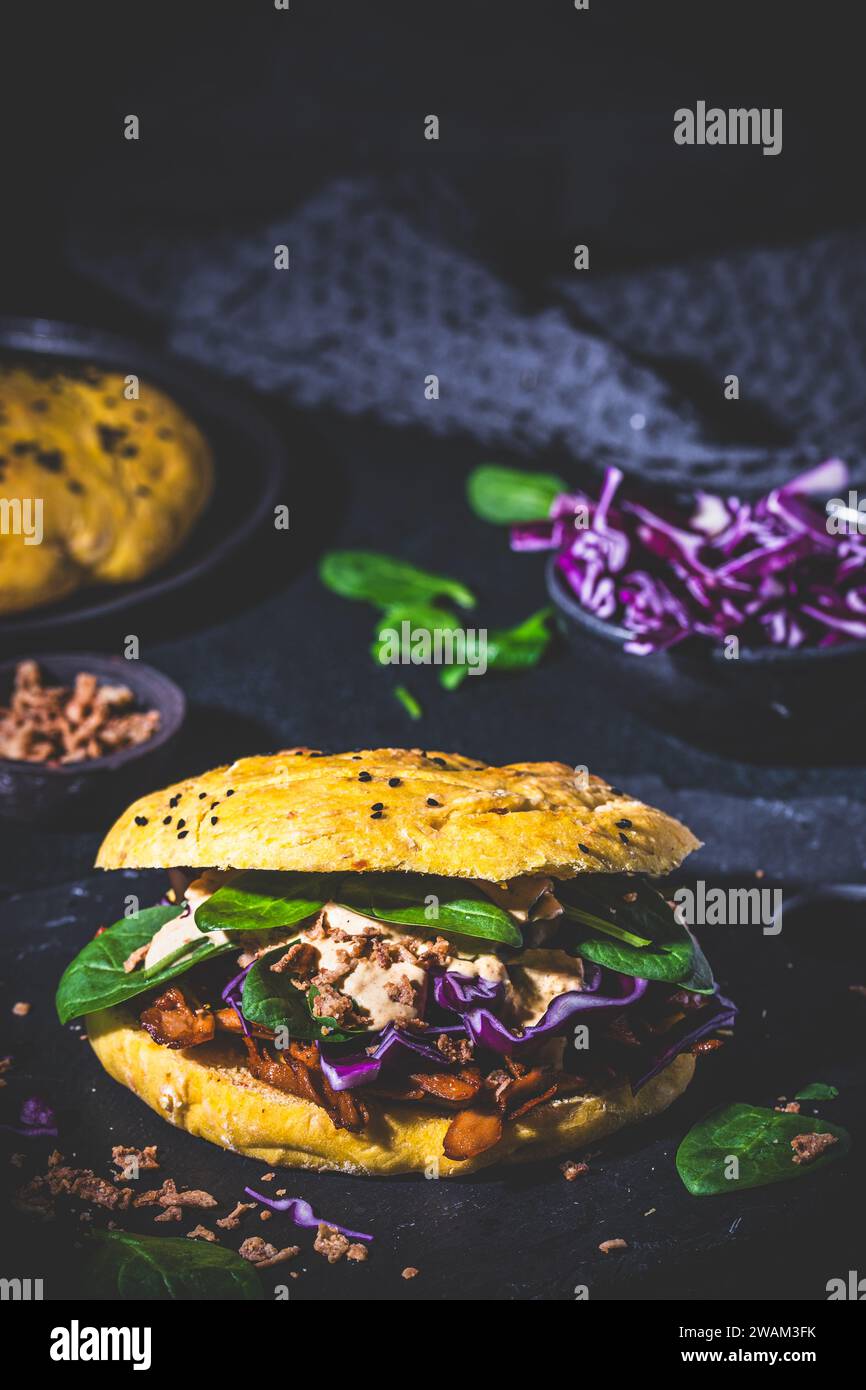 Homemade vegan doner burger in pumpkin flatbread filled with soy meat ...