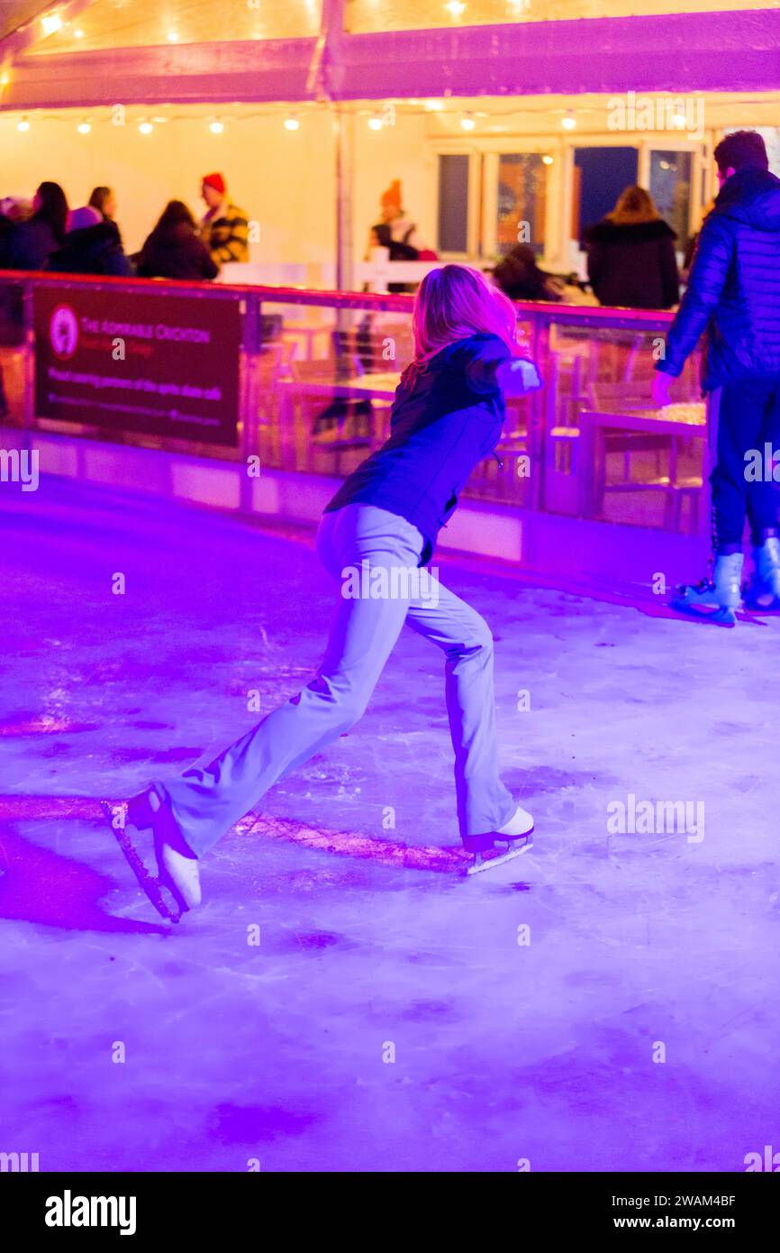 Ice skaters skate on the temporary seasonal Christmas / New Year Ice ...