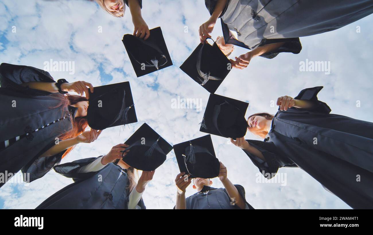 Graduates in robes caps hi-res stock photography and images - Alamy