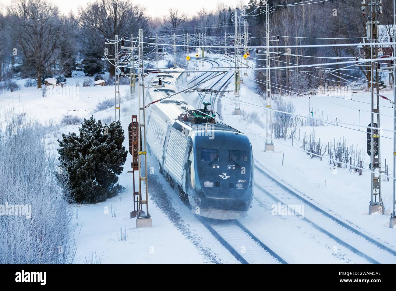 Seasonal weather, a X2000 train from SJ, just south Mjölby, Sweden ...