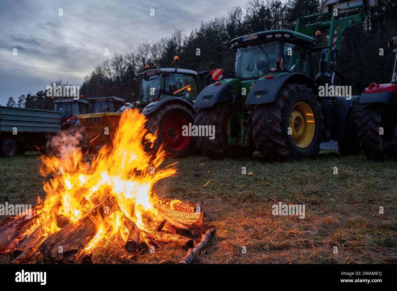 Burgpreppach, Germany. 05th Jan, 2024. A fire burns in front of a row ...