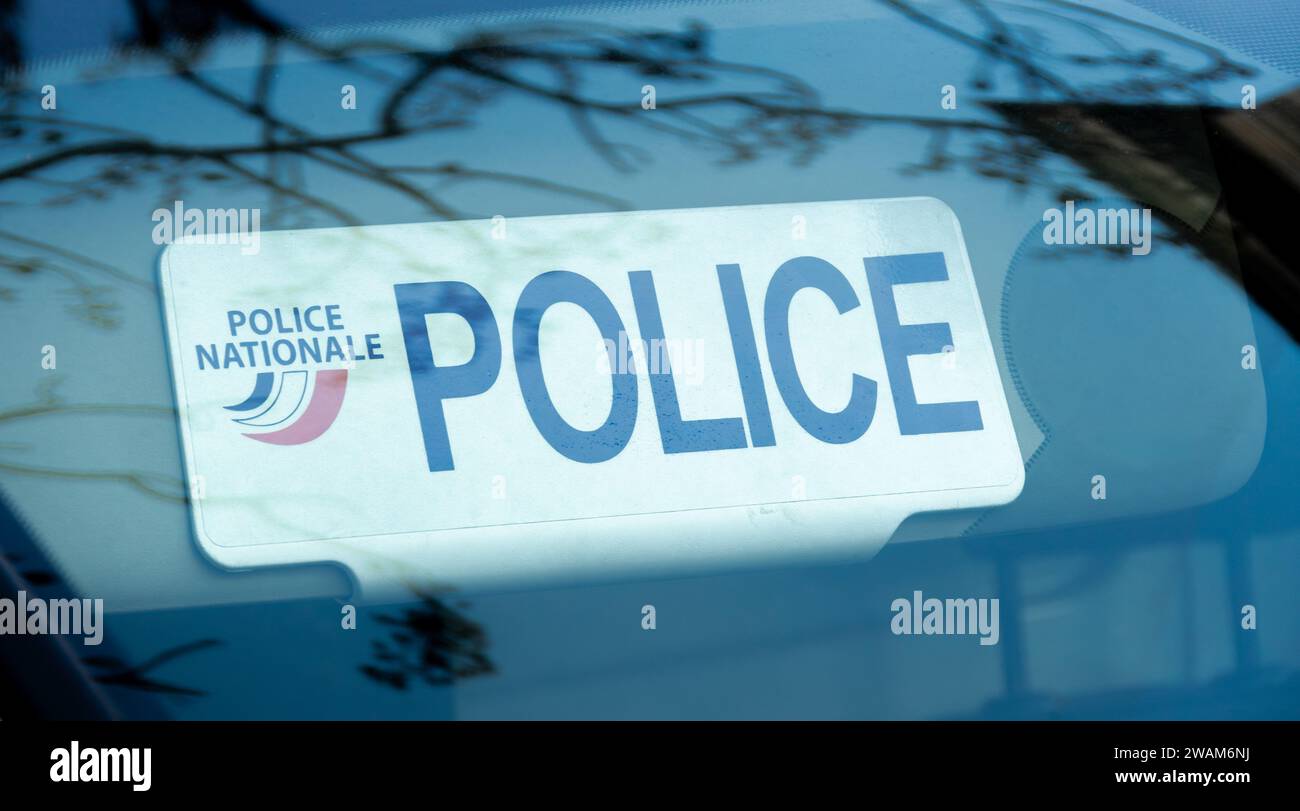 Close-up of the sun visor plate of an unmarked police vehicle with the ...