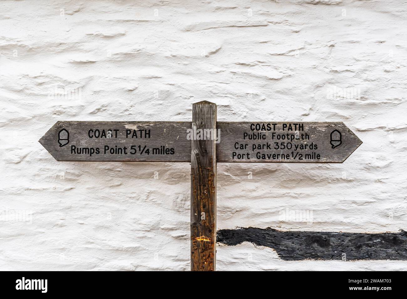 Signpost on the coast path on the north Cornish coast, showing two ...