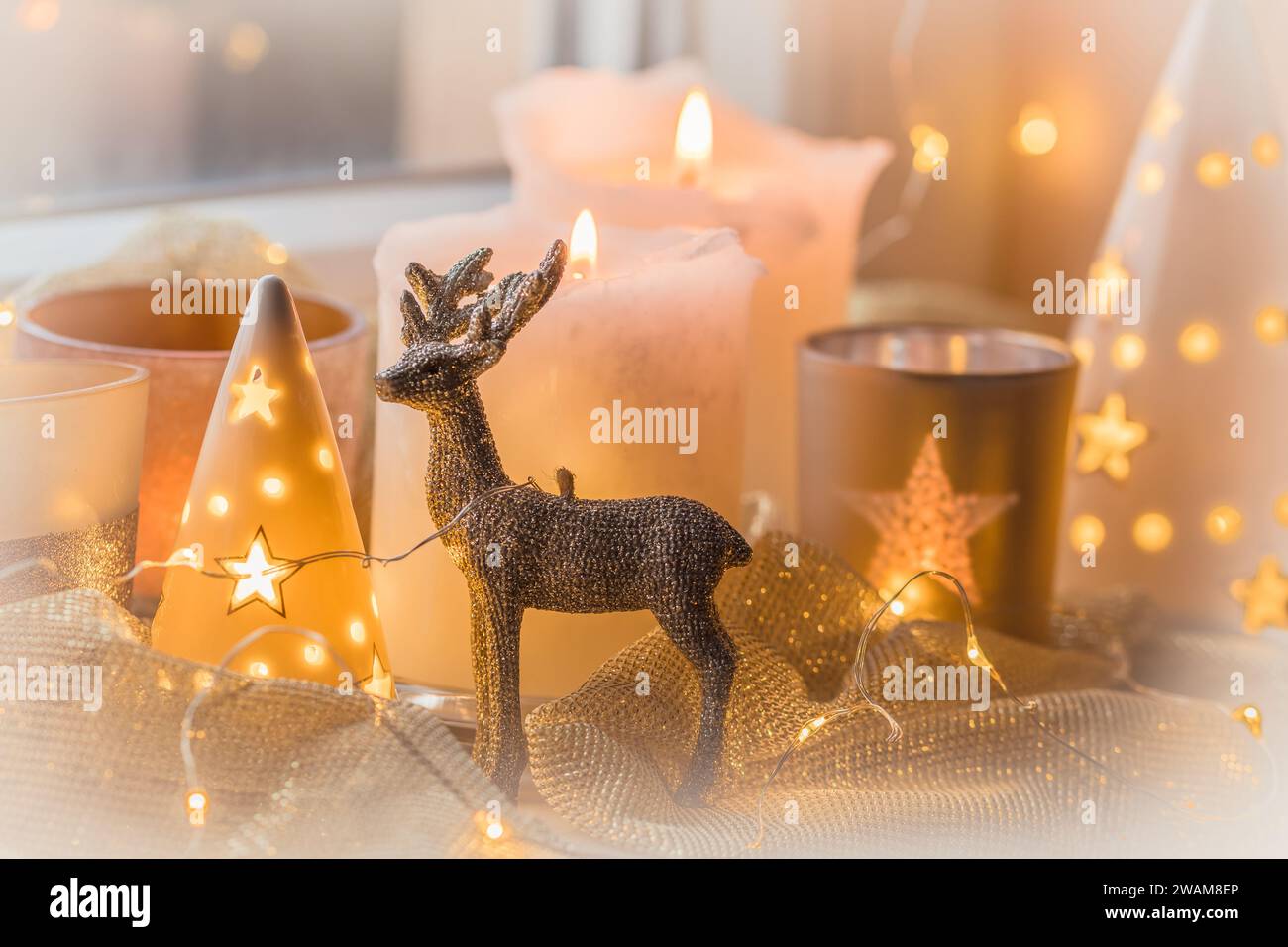 Christmas decorations in a window with glitter reindeer and various ...