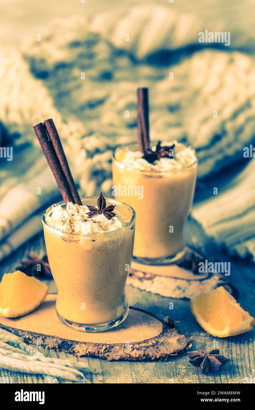 Two glasses of eggnogg with whipped cream and cinnamon. Auld Man's milk ...