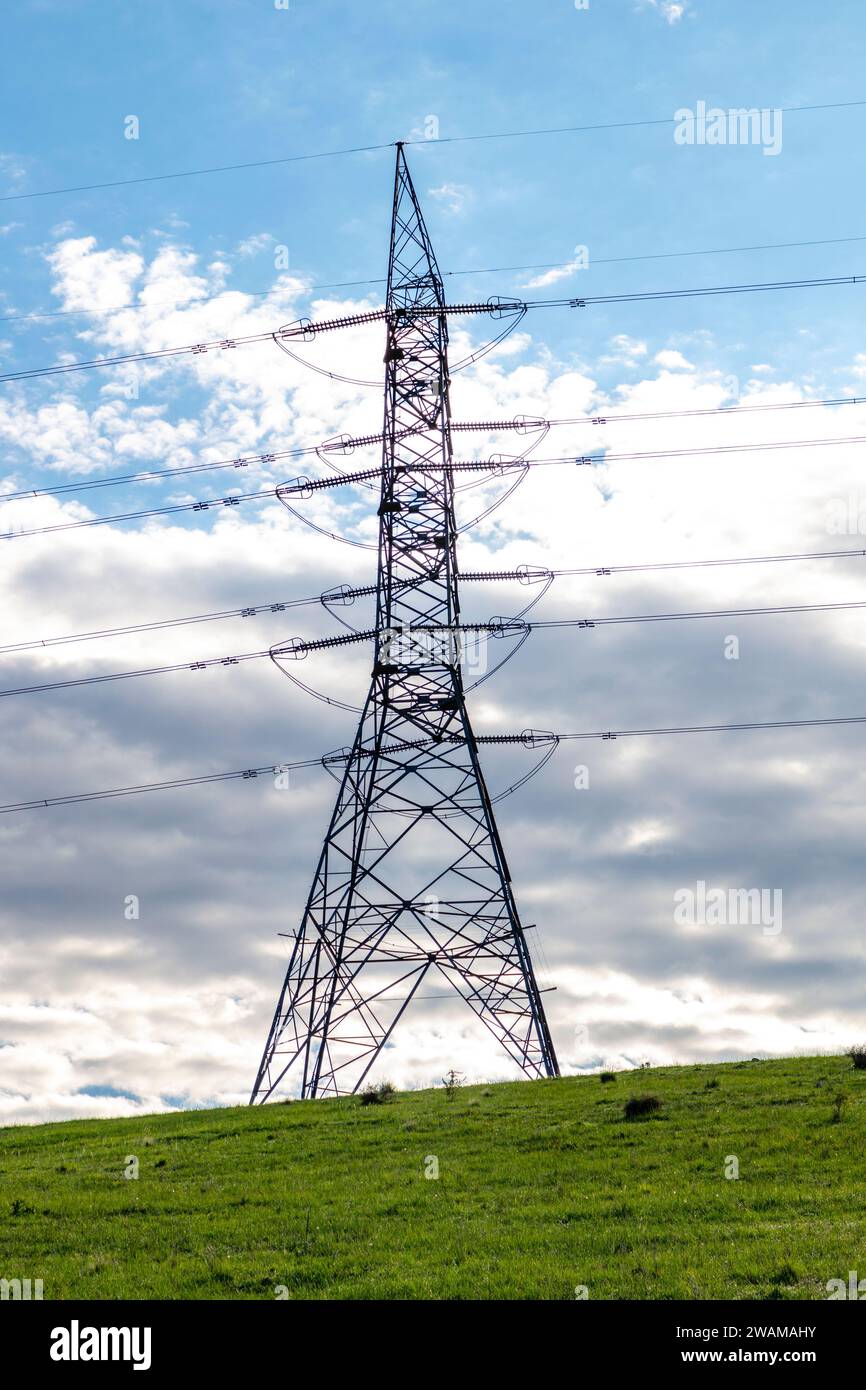 Photograph of a large telecommunications tower located on a green and ...