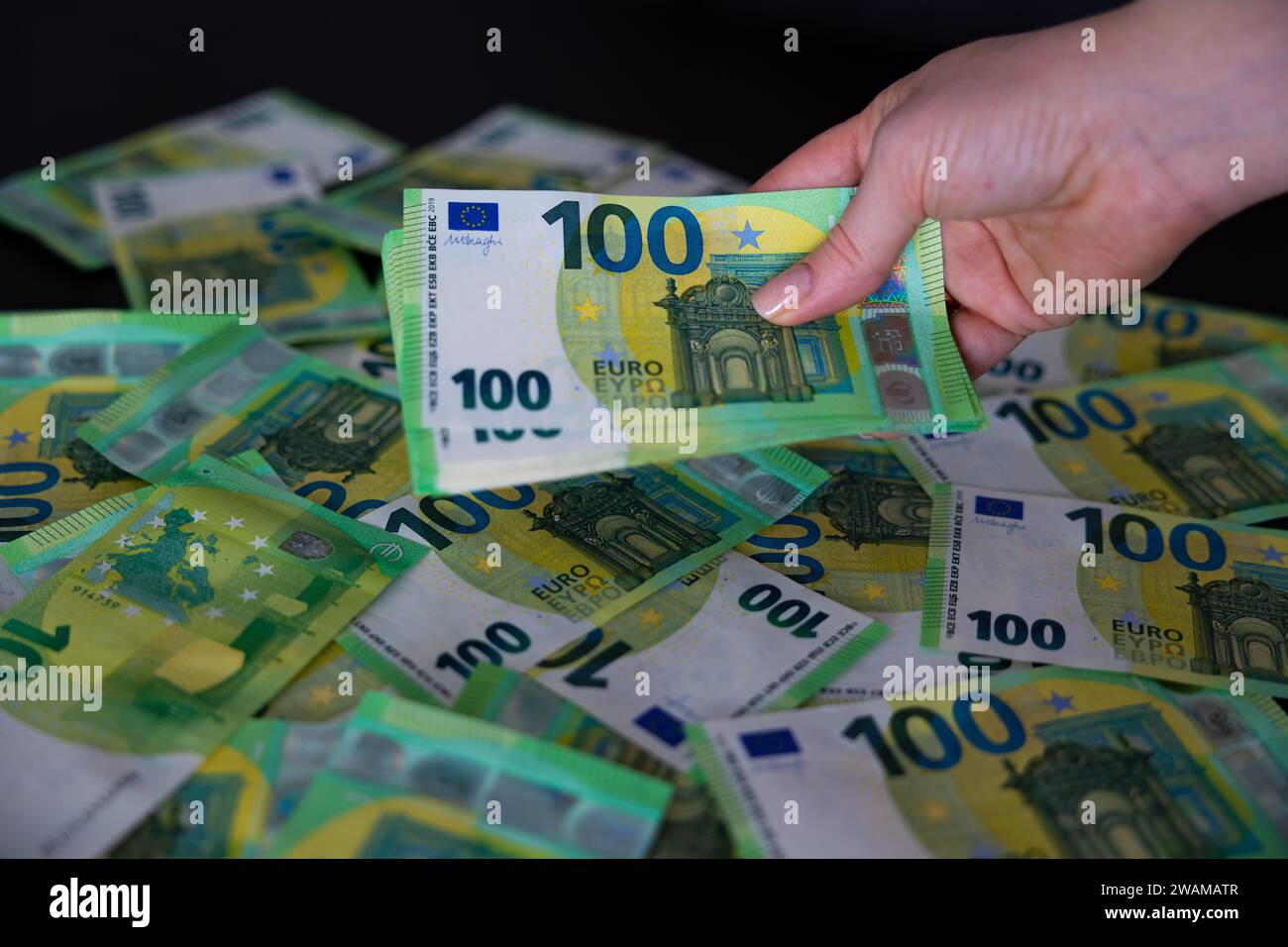Fan of paper Euro bills in female hands. Euro cash background on ...
