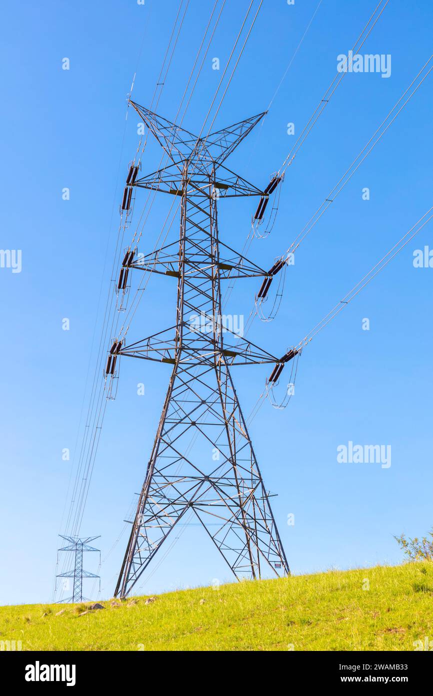 Photograph of a large telecommunications tower located on a green and ...