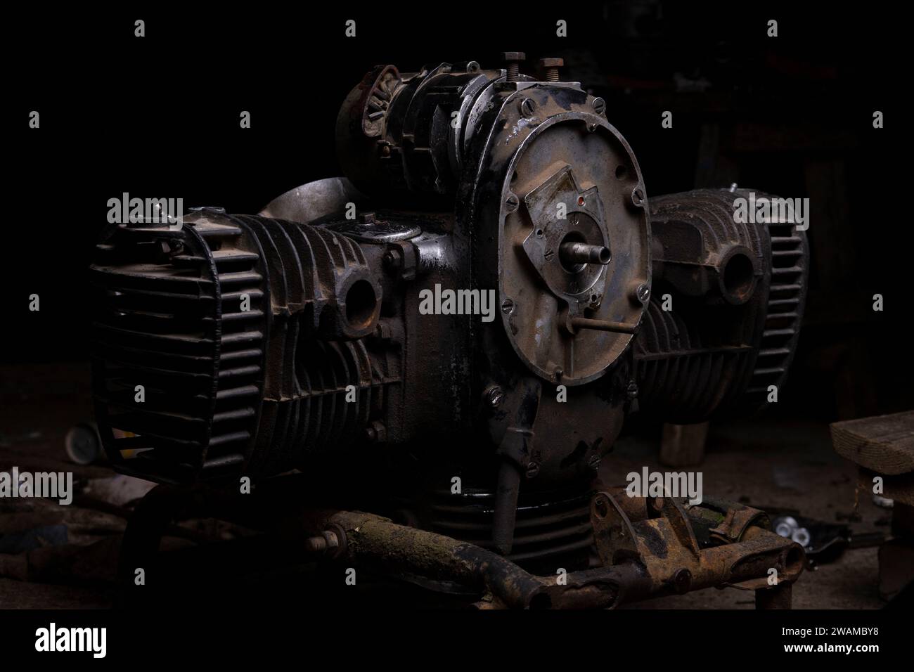 Old gasoline engine from a motorcycle on a black background Stock Photo ...