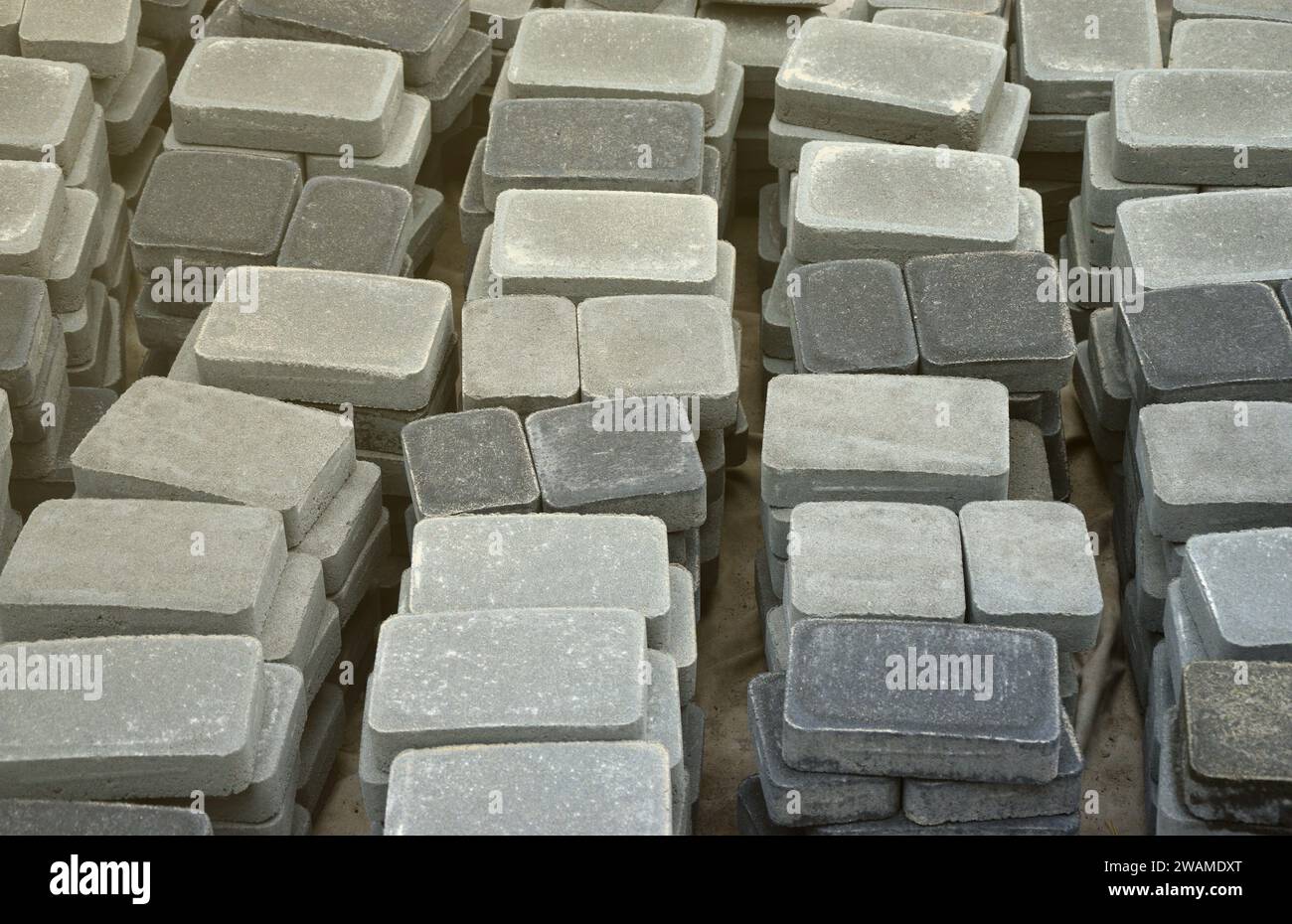 Pile of gray and dark grey walkway slab lying down outdoor. Material ...