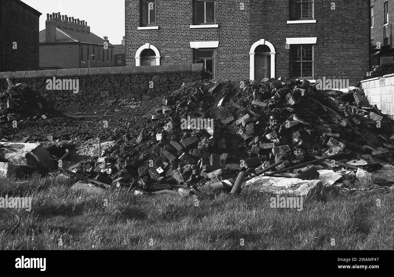 1960s, historical, a pile of rubble, broken stone, bricks and waster ...