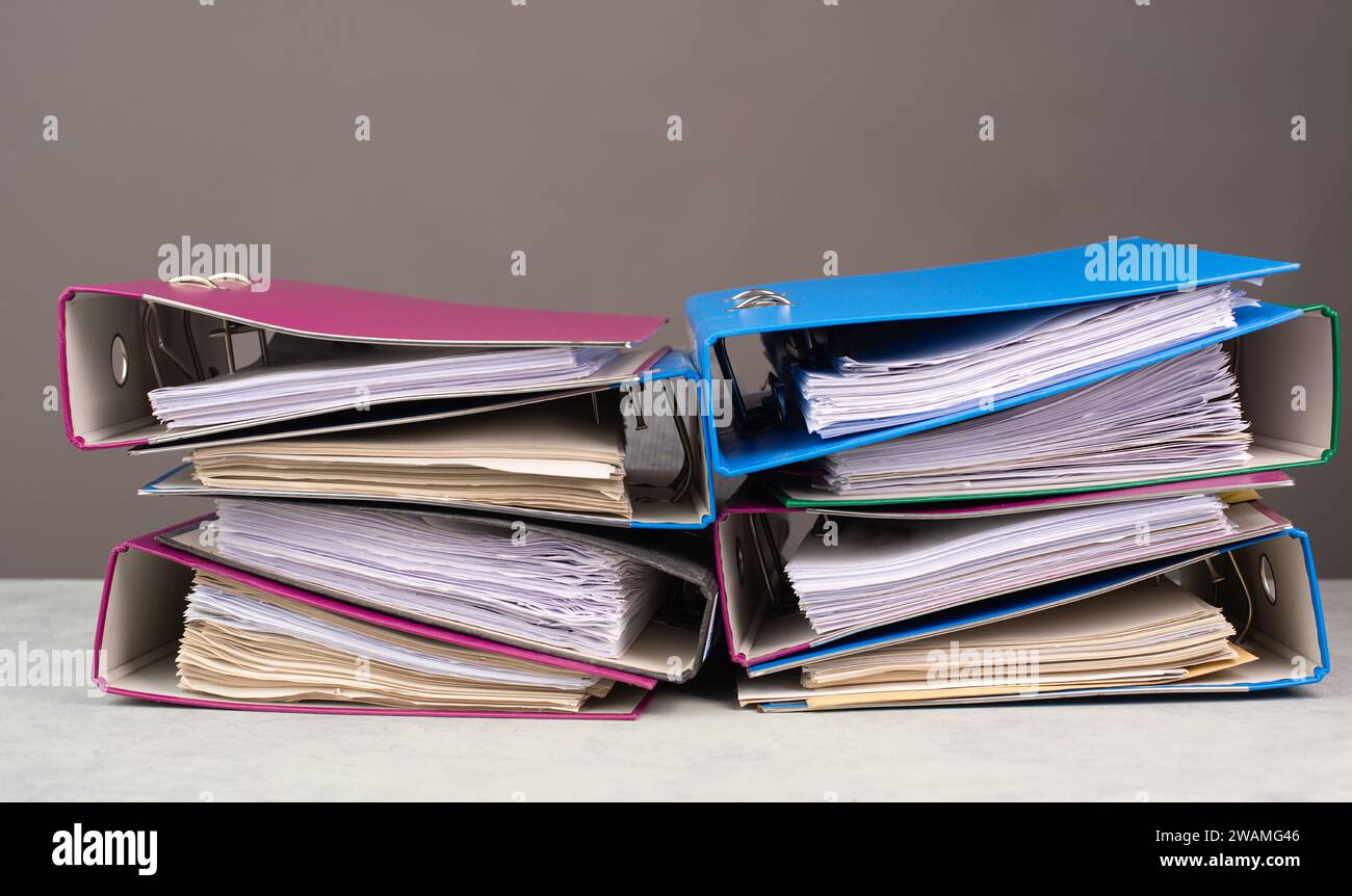 Pile of file folders, burnout, stress and overworked, pressure at work ...