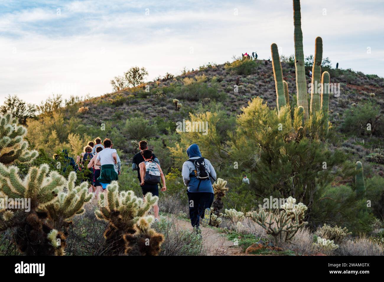 A group of teenage boys running uphill at Apache Wash Trail in Phoenix ...