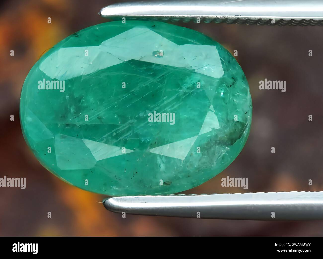 natural green emerald beryl gem on background Stock Photo - Alamy