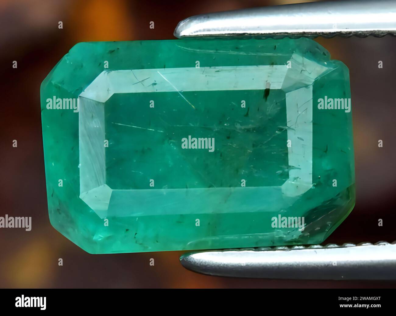 natural green emerald beryl gem on background Stock Photo - Alamy