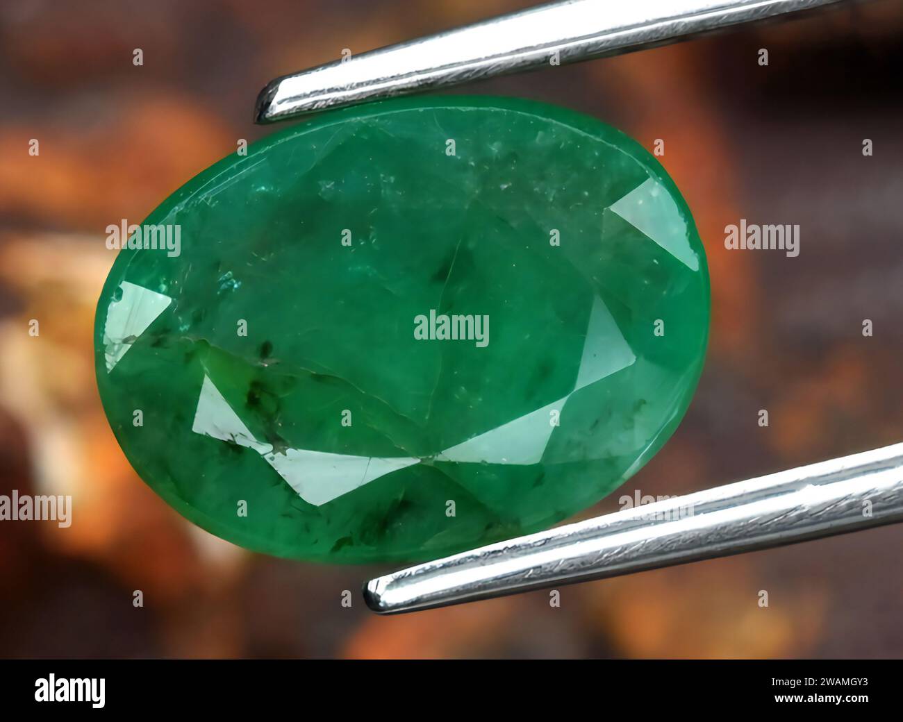 natural green emerald beryl gem on background Stock Photo - Alamy