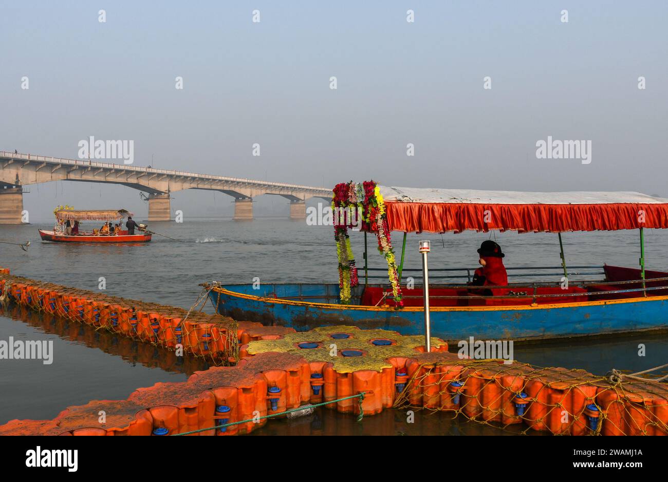 A boat seen anchored on the banks of the Sarayu river. The ancient city ...