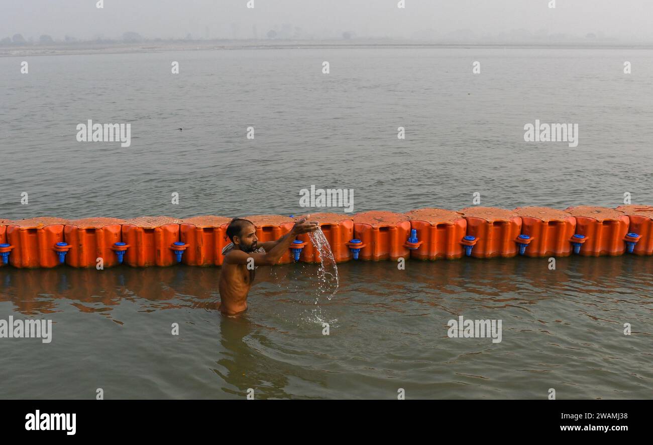 A Hindu priest performs rituals at Sarayu River. The ancient city of ...