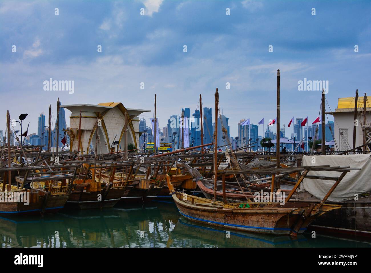 Qatar, Doha skyline and old sailing boats Stock Photo - Alamy