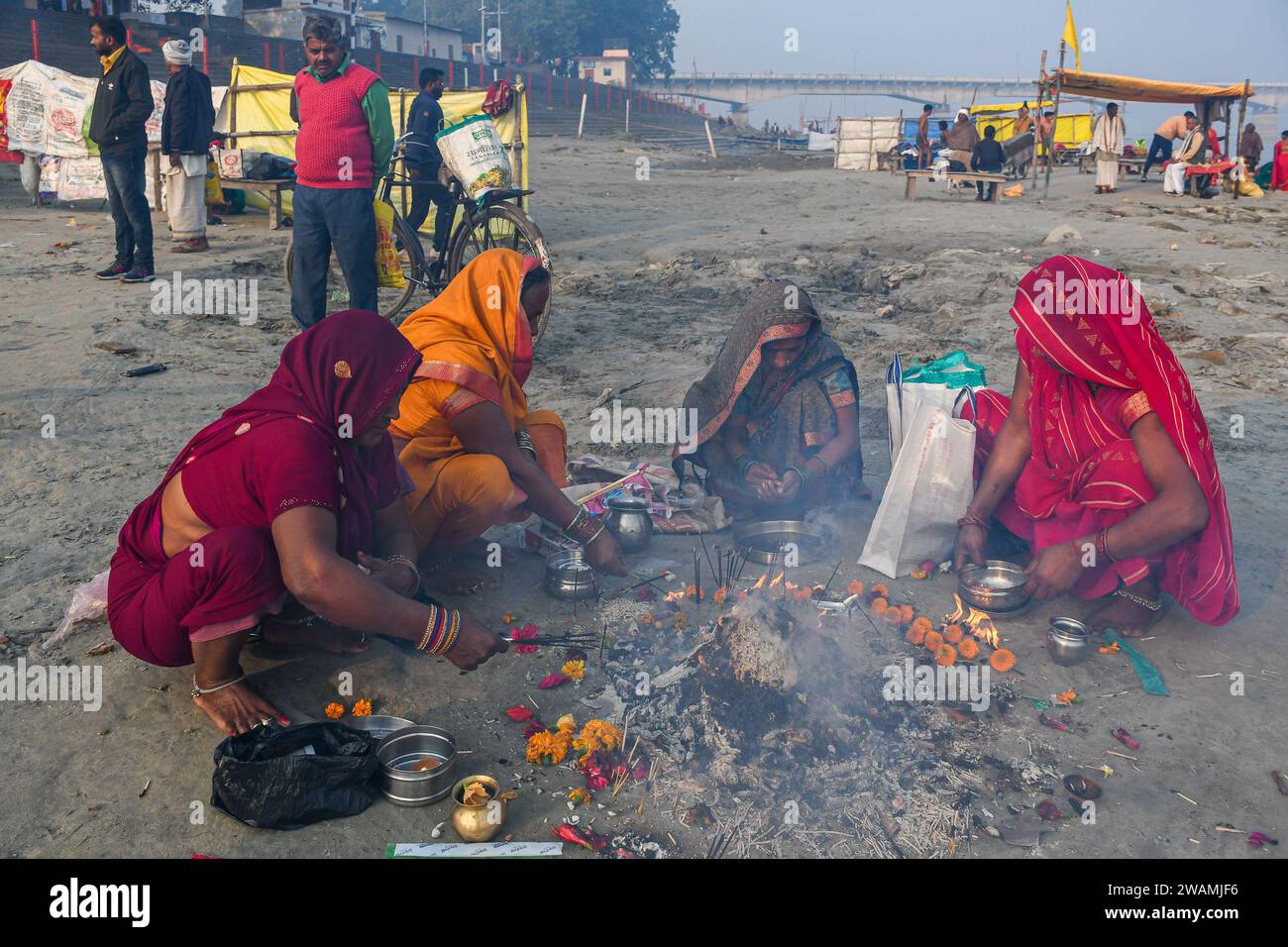 Ayodhya, India. 26th Dec, 2023. Devotees burn incense sticks as part of ...