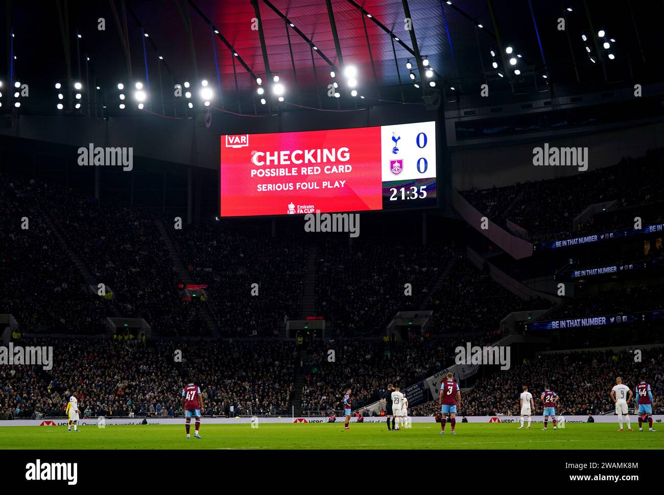 A VAR check for a possible red card is shown on screen following a foul ...